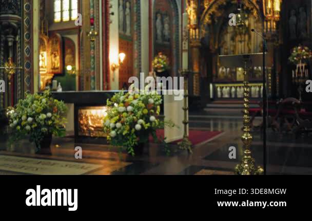 Defocused view of ornate catholic church interior featuring decorative ...
