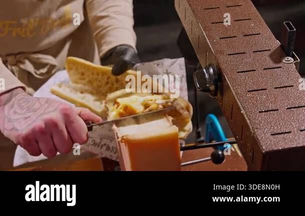 Traditional cheese raclette. Food culture in France. A warm and ...