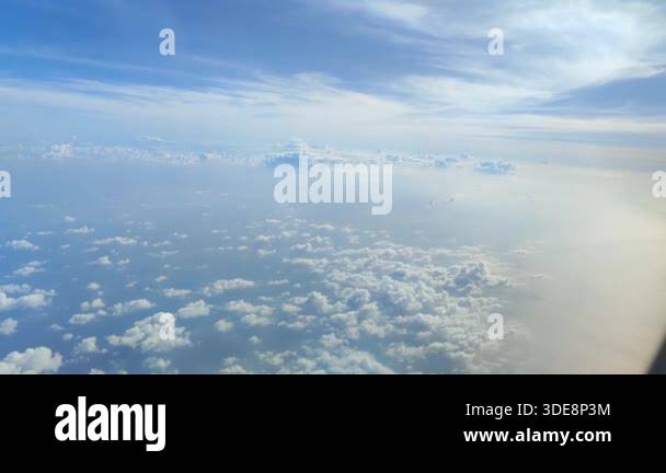 Airplane flying over the ocean with clear blue sky. Airplane wings ...