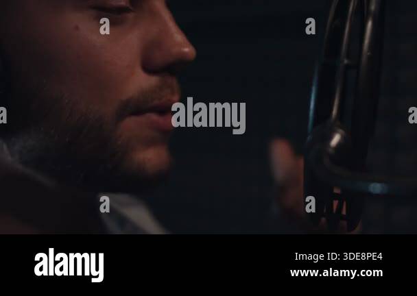 Male rap singer in headphones with professional microphone Stock Video ...