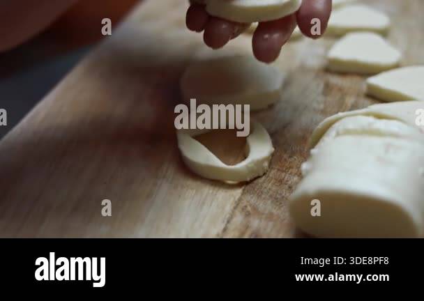 Cutting heart shaped mozzarella bites, close up Stock Video Footage - Alamy