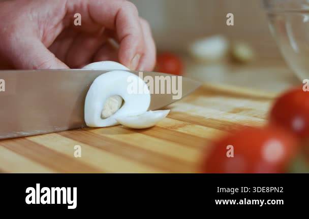 Cutting hard boiled egg on wooden cutting board Stock Video Footage - Alamy