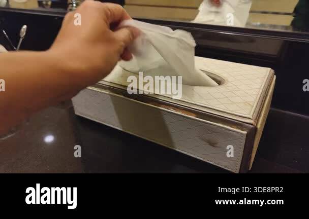 hand pull out a piece of tissue from tissue paper box Stock Video ...