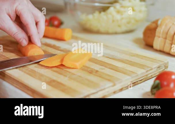 Cutting a boiled carrot for Russian potato salad Stock Video Footage ...