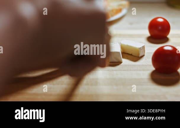 Cutting brie soft cheese on a cutting board Stock Video Footage - Alamy