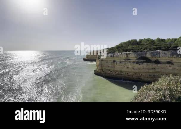 Beautiful Fontainhas Beach surrounded by yellow cliffs, Algarve ...