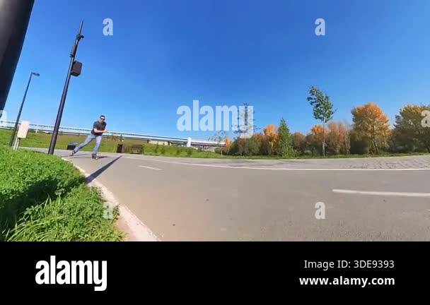 A Caucasian man rollerblades quickly Stock Video Footage - Alamy