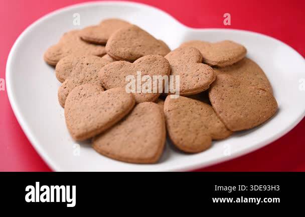 Hand Taking Heart Shaped Valentine Cookie from Plate Stock Video ...