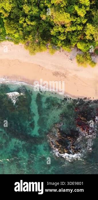 Amazing aerial top down view of a pristine tropical beach. Crystal ...