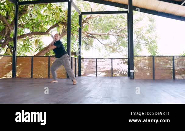 Professional male dancer practicing an expressive and acrobatic ...