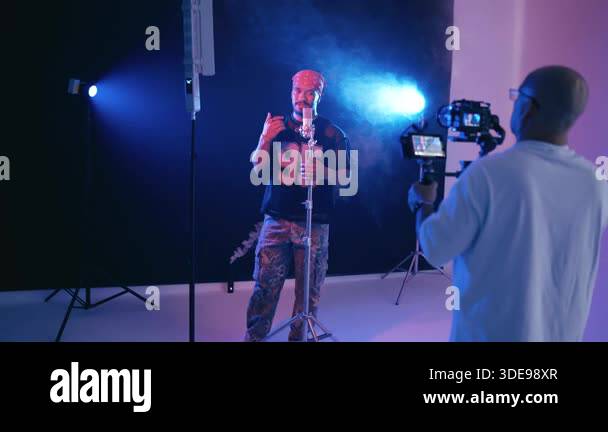 Behind the scenes of a music video production with a male reggaeton ...