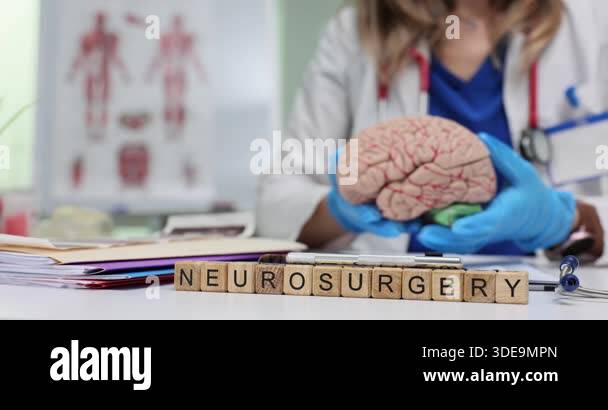 Wooden blocks spell word Neurosurgery on medical desk. Woman doctor in ...