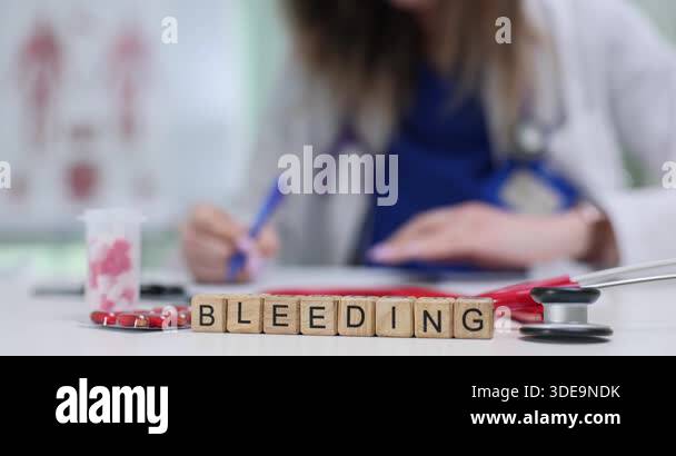 Wooden blocks spell word Bleeding near pills and test tube. Woman ...