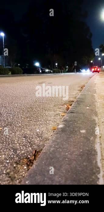 Estarreja, Portugal - 23.12.2025: Cars driving back and forth on a ...