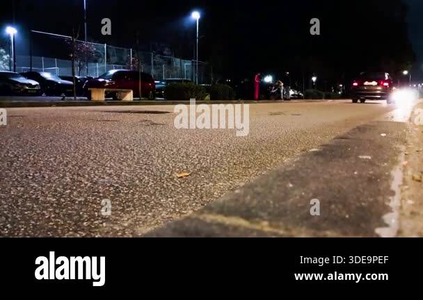 Estarreja, Portugal - 23.12.2025: Cars driving back and forth on a ...