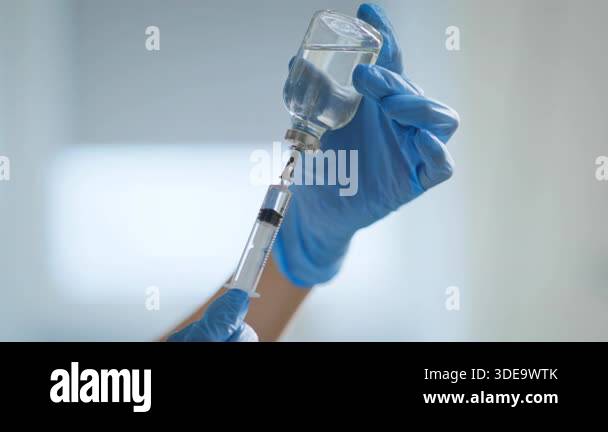 Medical nurse hands preparing vaccine dose for injection patient ...