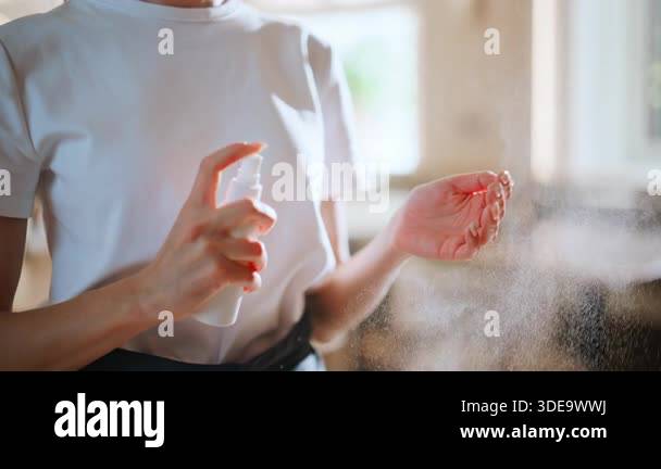 Restaurant staff sanitizing hands at light modern restaurant workplace ...