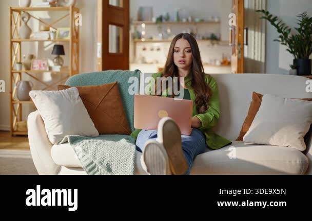 Distant manager browsing laptop developing e-commerce project at home ...