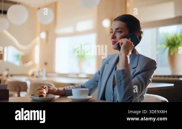 Business lady talking cellphone sitting cafeteria closeup. Positive ...