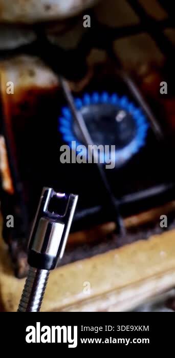 Macro shot of a metal electric lighter generating a purple plasma arc ...