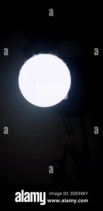 Extreme close-up of a bright white circular LED light source glowing ...