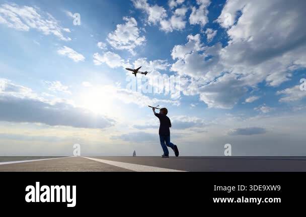 A child running on the road holding an airplane at sunset(Produced ...