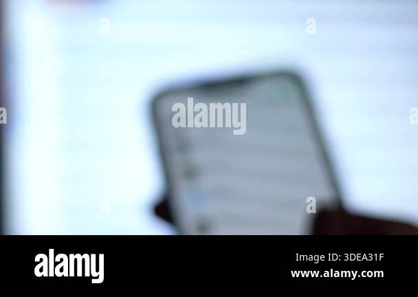 User make chat with mobile app in view of blur background Stock Video ...