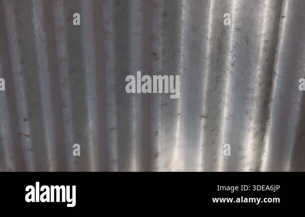 Sunlight patterns changing on textured metal surface Stock Video ...