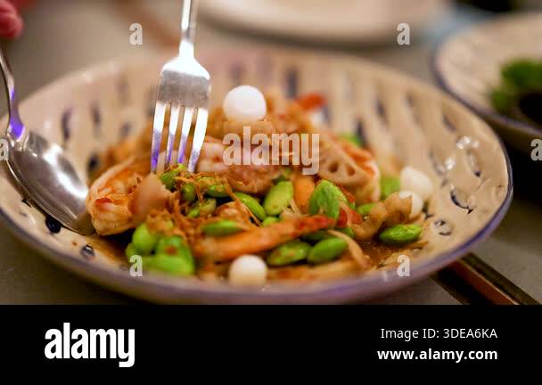 Delicious prawn dish with vibrant vegetables Stock Video Footage - Alamy