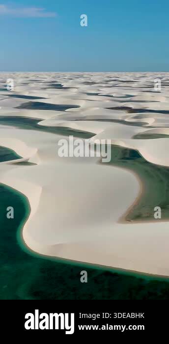 Sand dunes mountains and rain water lagoons at northeast brazilian paradise. World travel ...