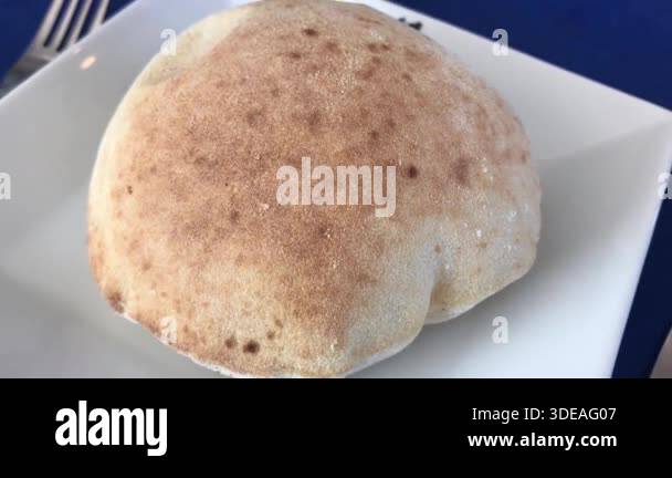 Puffy round Arabic bread served in Egyptian restaurant Stock Video ...