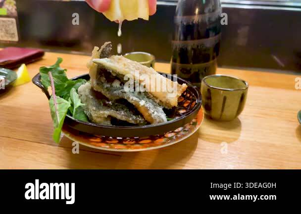 Delicious fried fish served with greens and drink Stock Video Footage ...