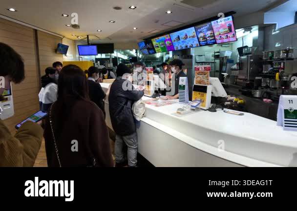 Customers ordering food at a fast food counter Stock Video Footage - Alamy