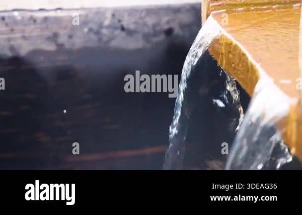 Water flows over a wooden dam structure Stock Video Footage - Alamy