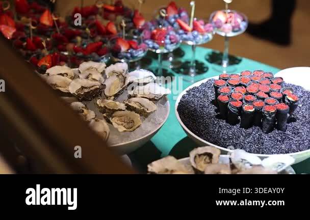 sushi and oyster buffet display with roetopped sushi and chilled ...
