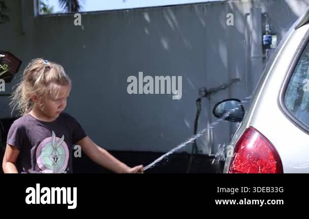 little children twin sisters wash moms car. High quality 4k footage ...