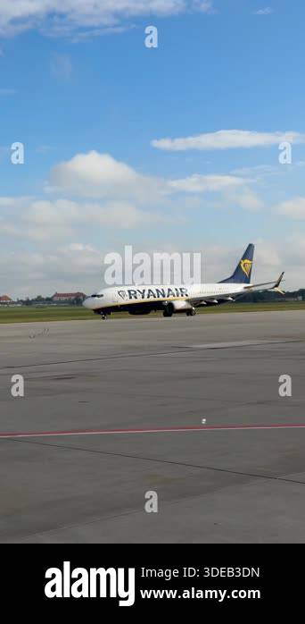 Ryanair aircraft Boeing taxiing on runway before takeoff or after ...