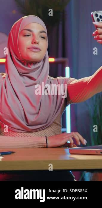 Attractive elated cheerful 30-aged muslim lady in light-violet hijab ...