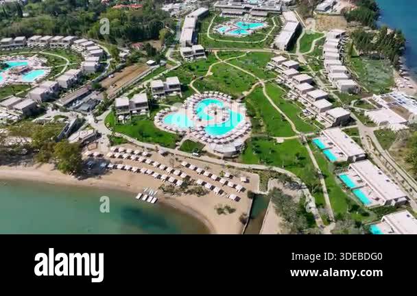 Aerial drone flight over the Ikos Odisia luxury 5-star resort in Dassia ...