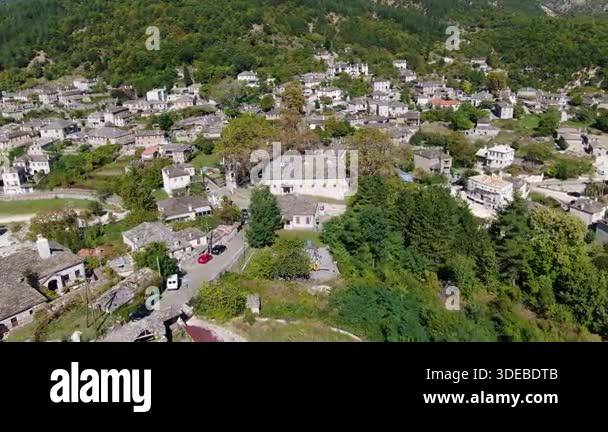 Drone footage of stone buildings and parking area in Papingo village ...