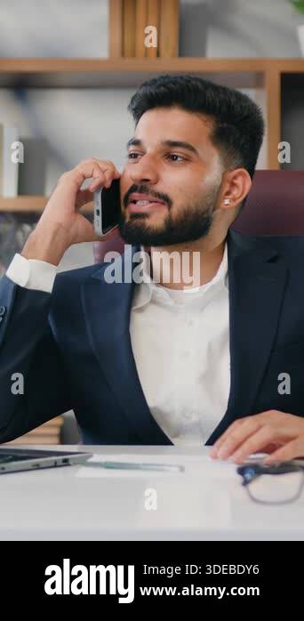 Handsome smiling hispanic bearded employee guy in formal clothes is ...