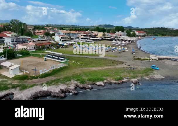 Aerial drone view of Roda beach in North Corfu Greece with sunbeds ...