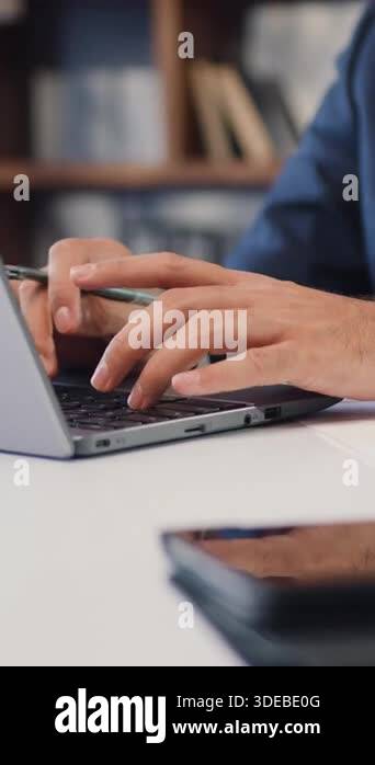 Close-up of hands of unrecognizable business man typing on laptop ...
