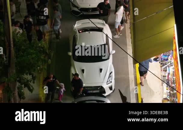 Overhead Aerial View of White Nissan GT-R Supercar Parked on Busy City ...