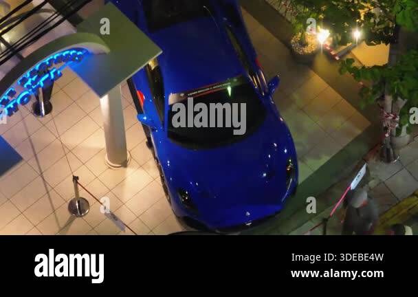 High Angle Top Down View of Blue Luxury Supercar Parked on Tiled ...