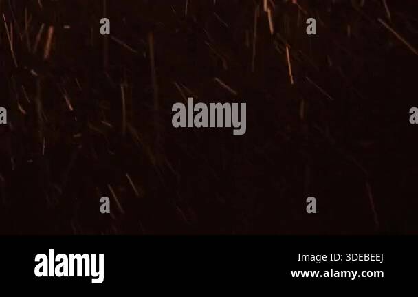 Violent snowstorm at night with snowflakes blowing aggressively through ...