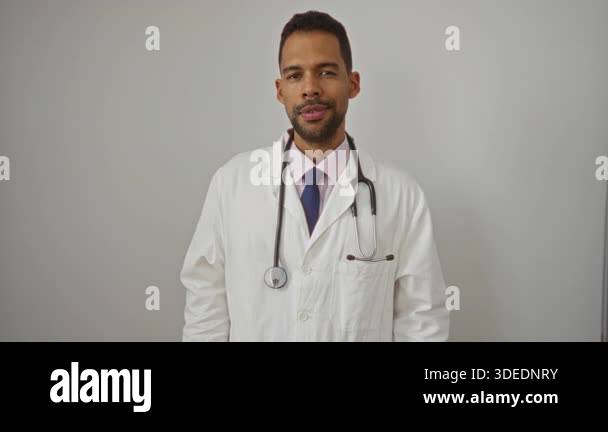Doctor confidently giving thumbs up wearing stethoscope and lab coat ...