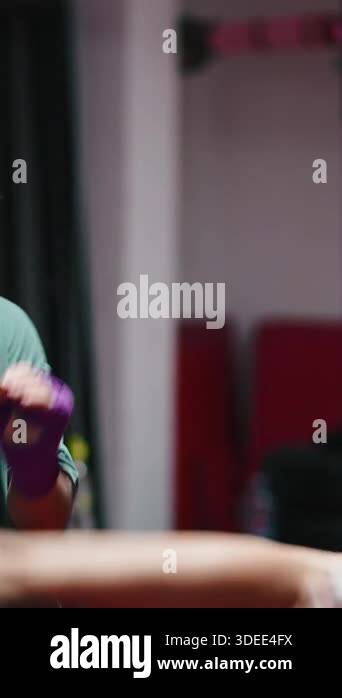 Two young athletes training together practicing punches and defensive ...