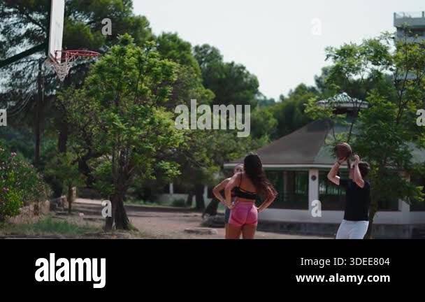 Group of teenage friends playing basketball together on an outdoor ...