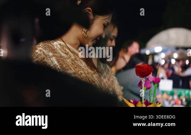 Two smiling asian women in traditional clothing enjoying the loi ...